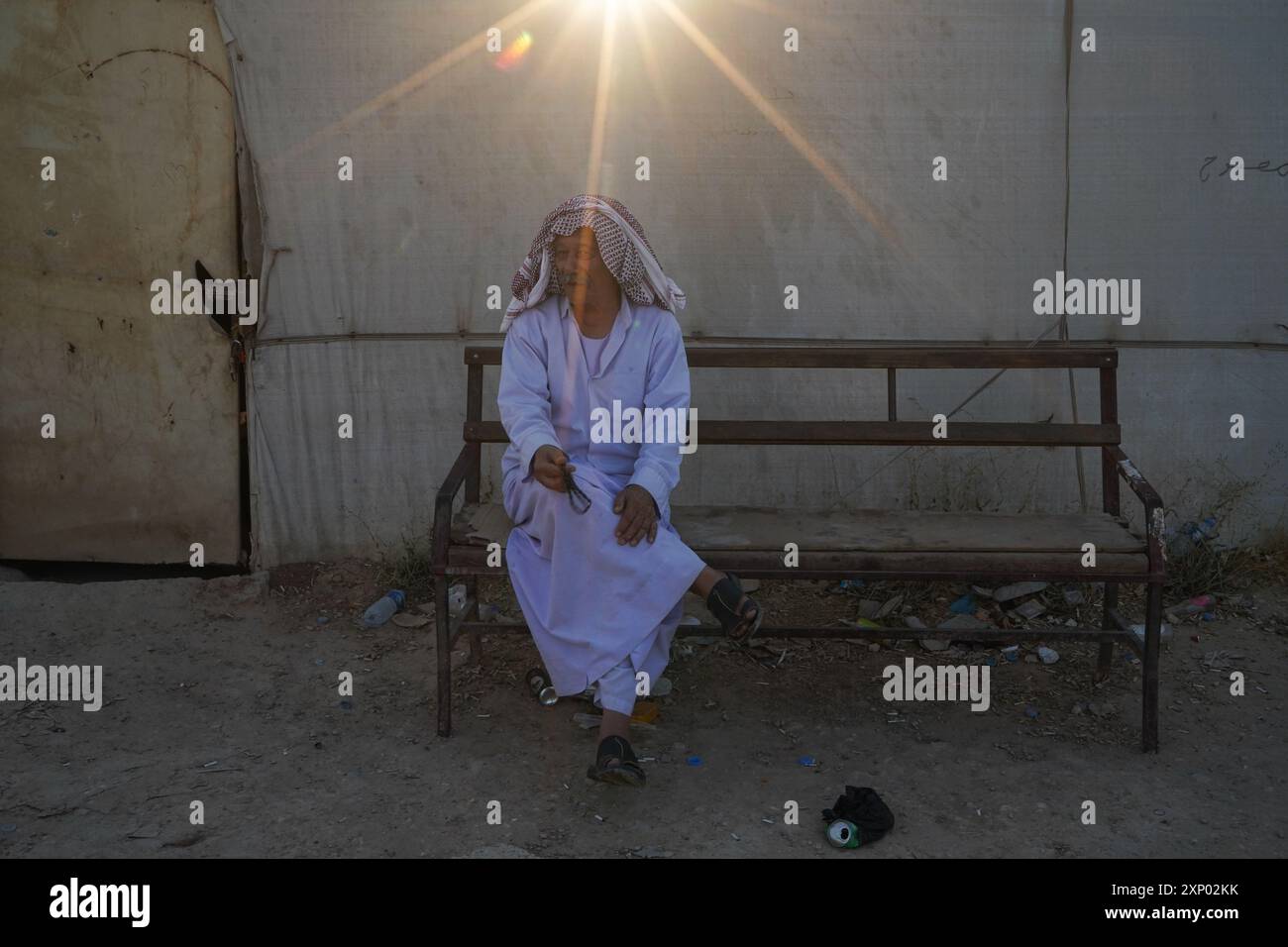 Dohuk, Iraq. 31st July, 2024. Iraqi Yazidi displaced elderly man sits ...