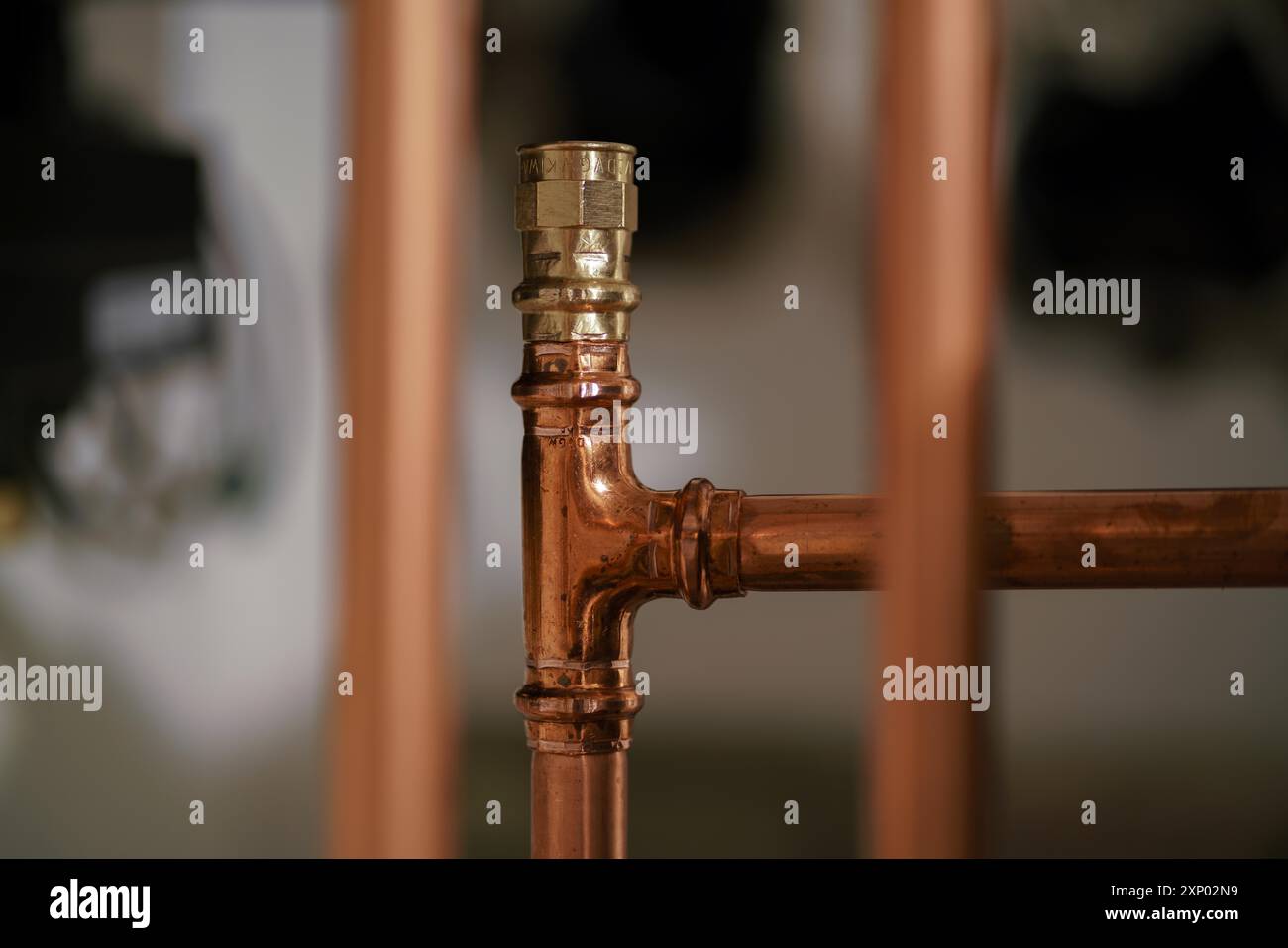 New nd shiny copper water pipes Stock Photo - Alamy