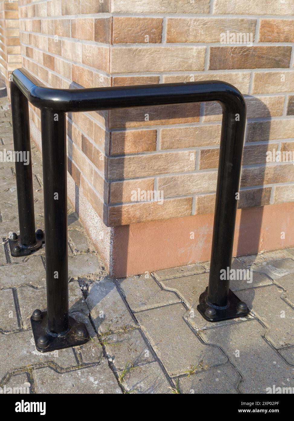 Metal Parking Barrier Protecting Brick Wall Stock Photo - Alamy