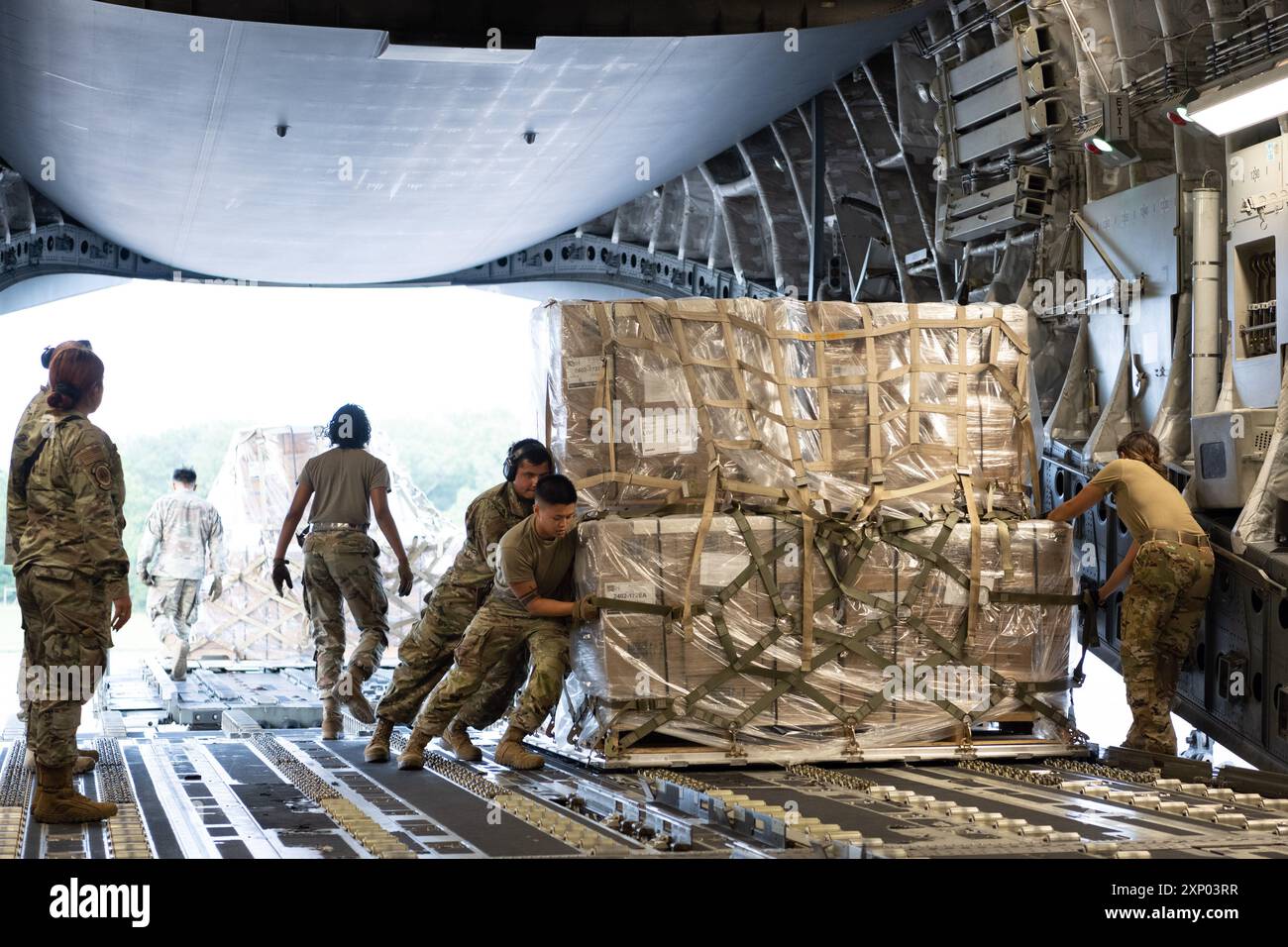 U.S. Airmen assigned to the 21st Airlift Squadron and 19th Logistics ...