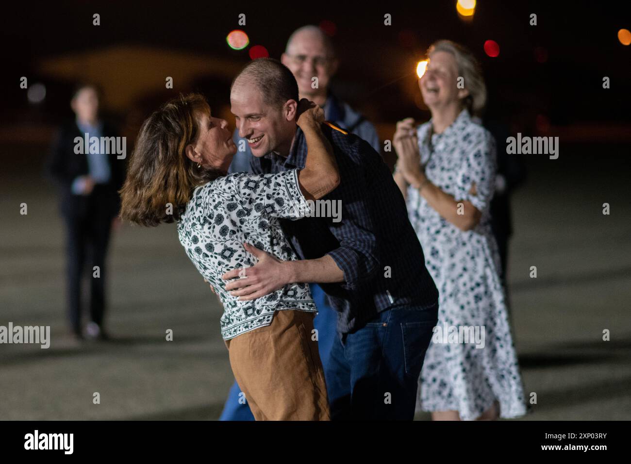 Wall Street Journal reporter Evan Gershkovich, right, embraces his ...