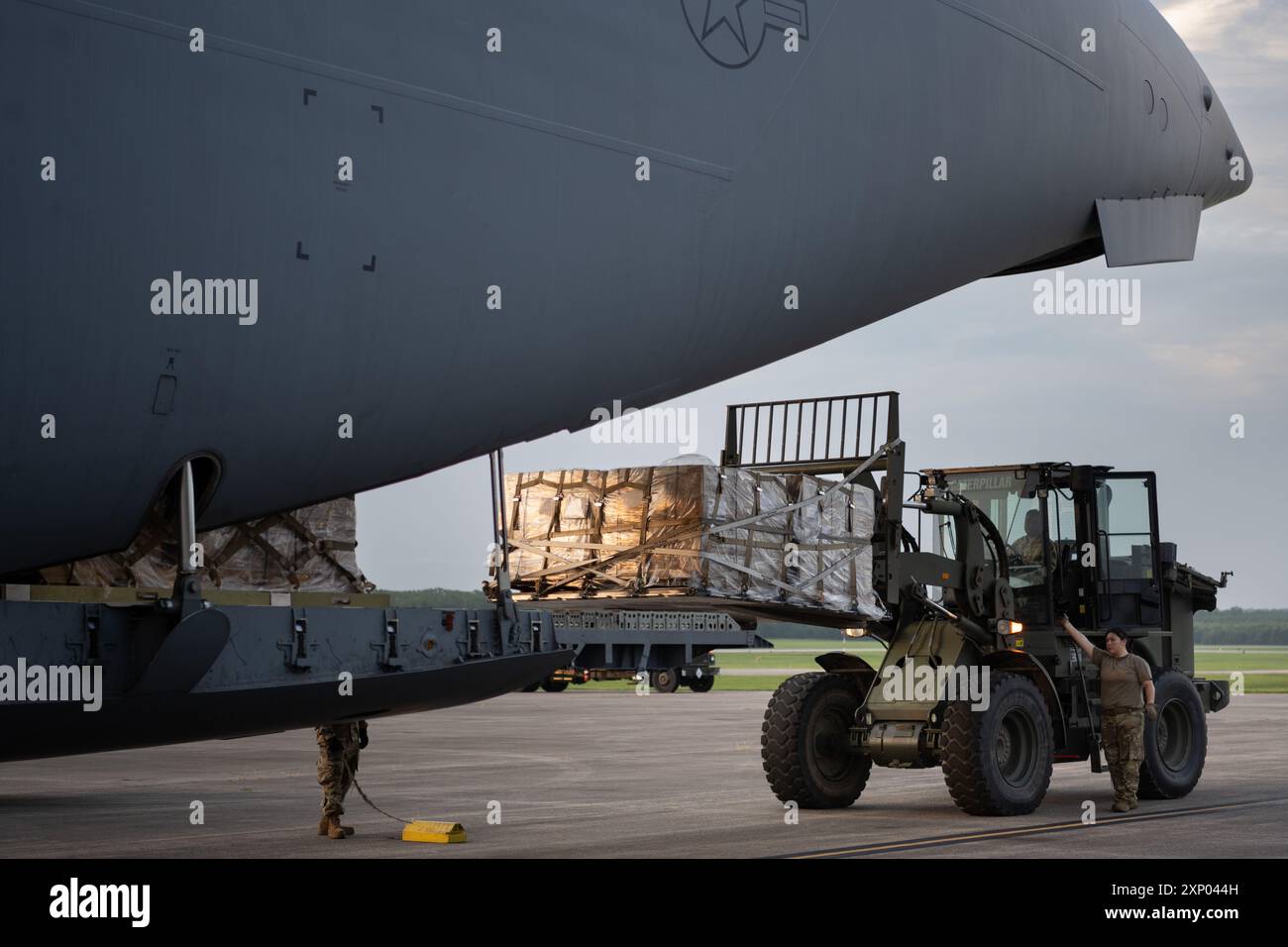 U.S. Airmen assigned to the 21st Airlift Squadron and 19th Logistics ...