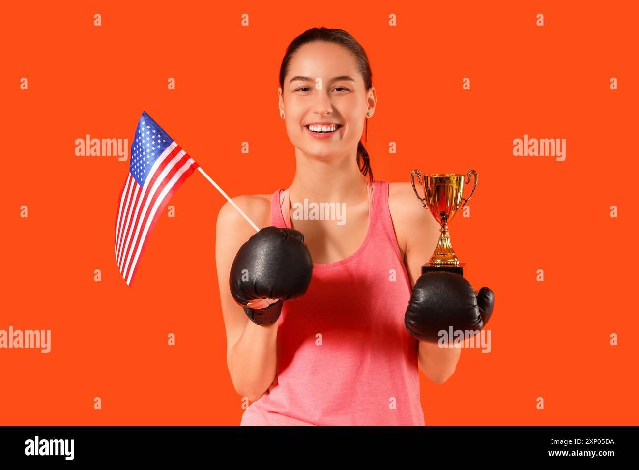 Female boxer with gold cup and USA flag on orange background Stock ...