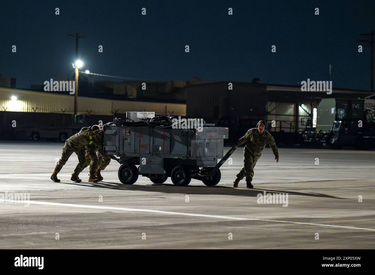 U.S. Airmen transport a power cart on the flightline during Bamboo ...