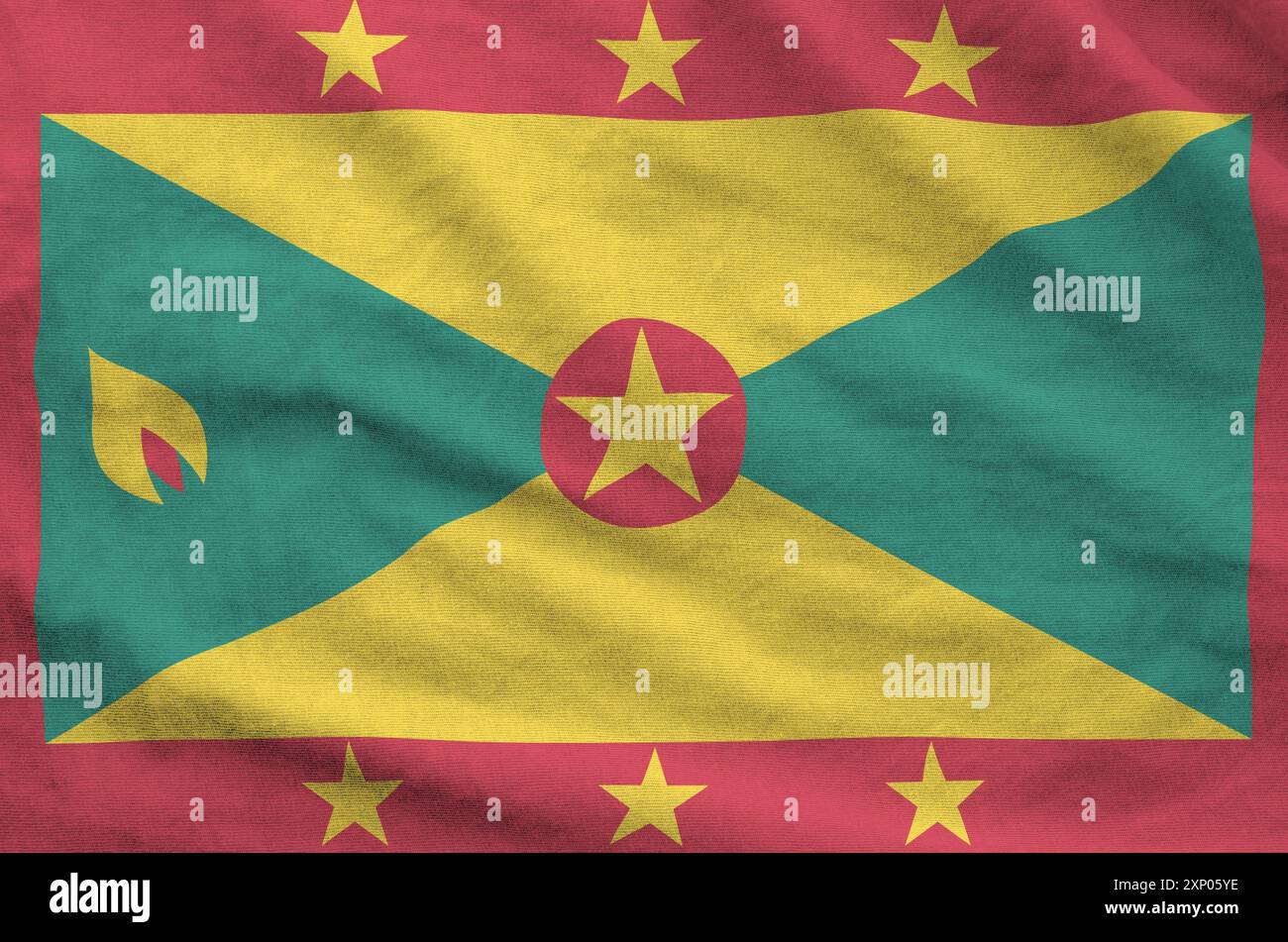 Grenada flag depicted on folded wavy fabric of old cloth close up Stock ...