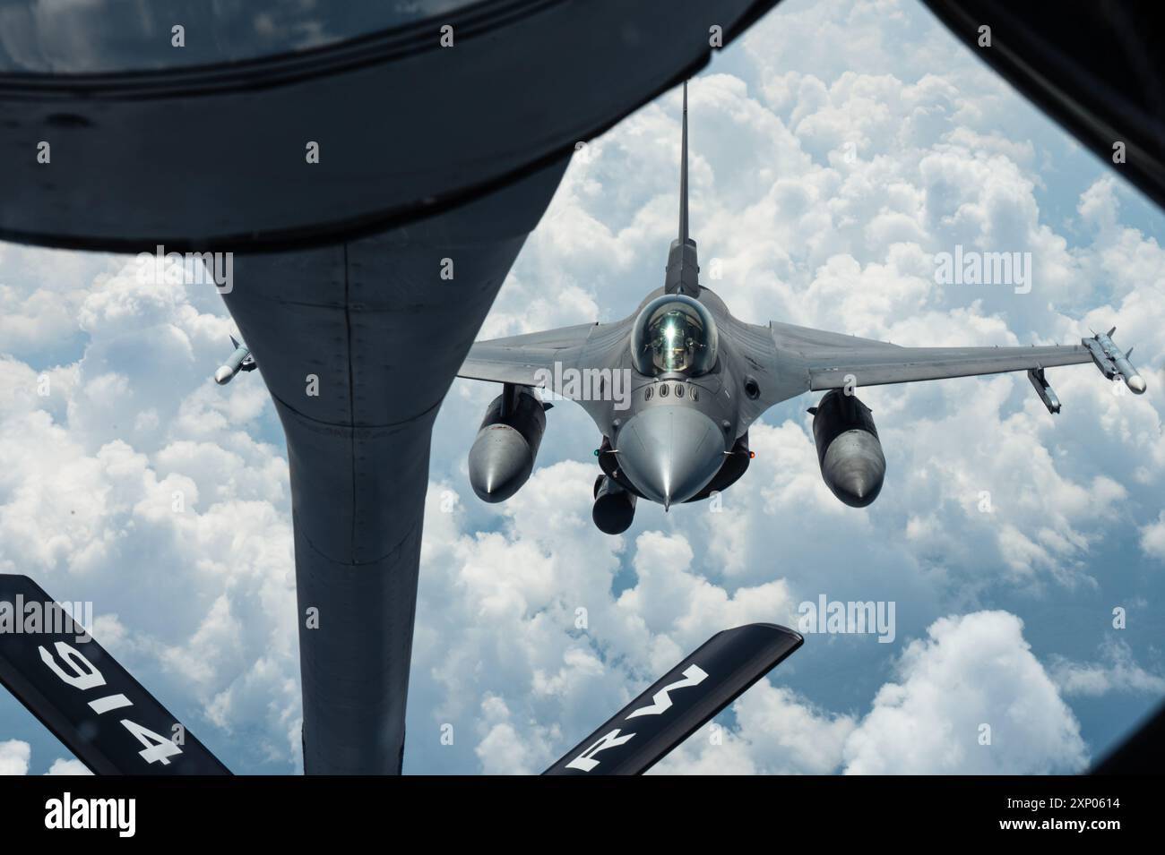 An F-16C Fighting Falcon attached to the 177th Fighter Wing, approaches a KC-135R Stratotanker ...