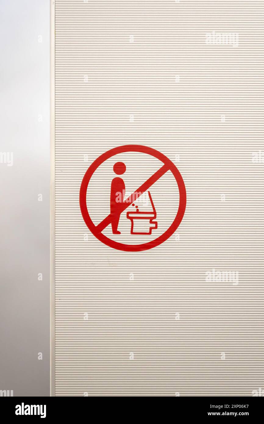 Pictogram, prohibition sign in a public toilet, peeing, urinating while ...