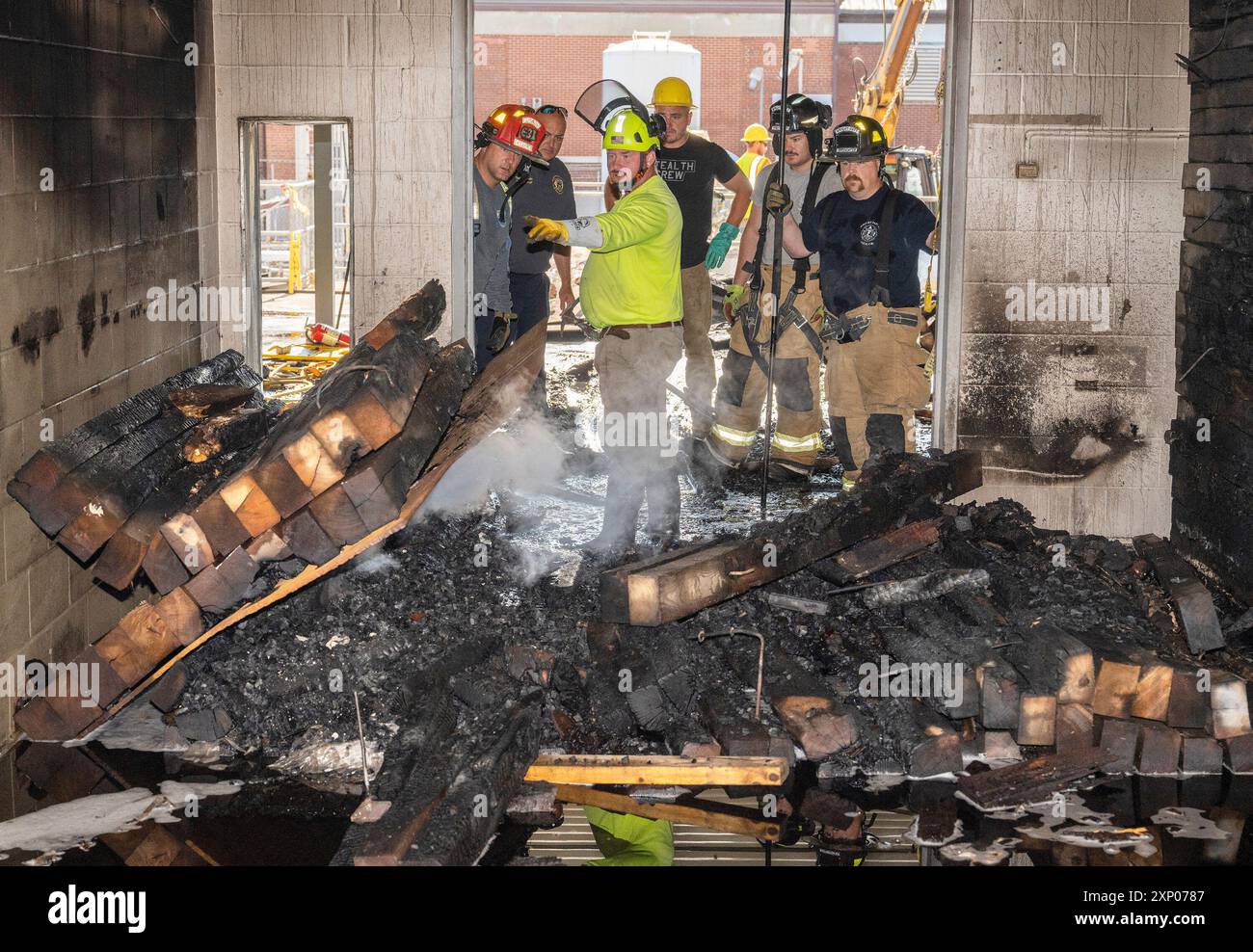 Members of the Wright-Patterson Fire Department and workers with the ...