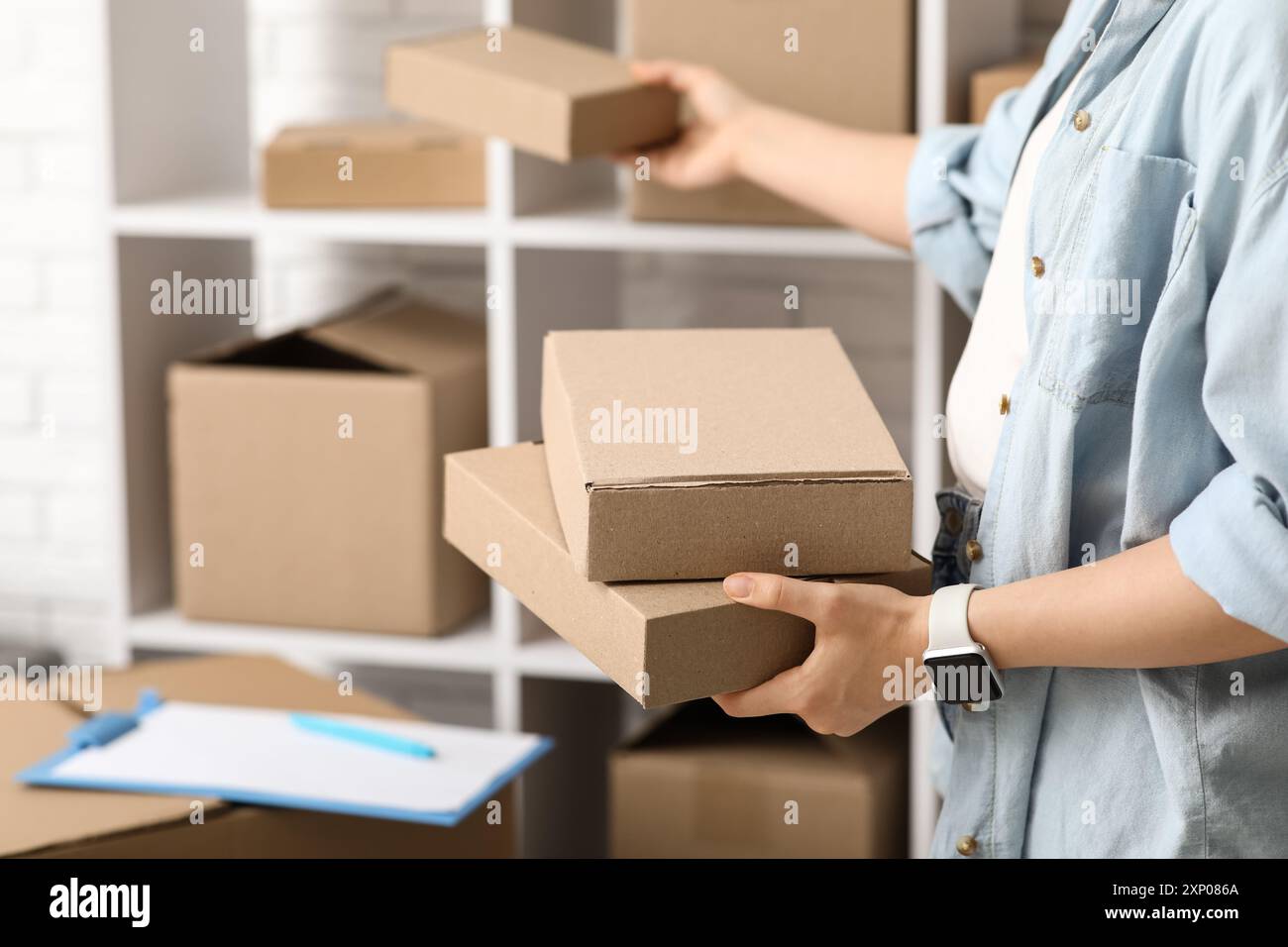 Woman taking inventory in warehouse hi-res stock photography and images ...