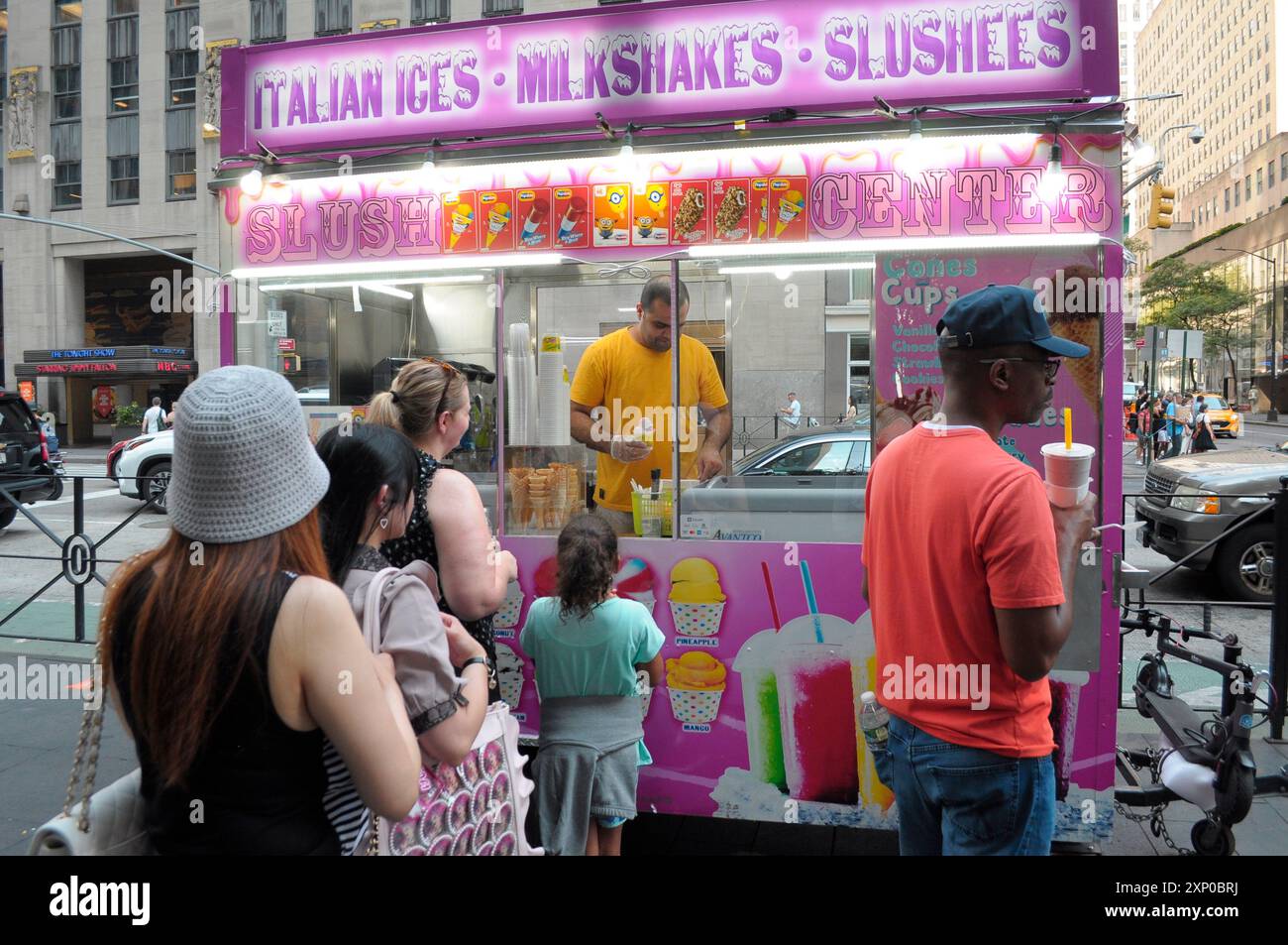 People order ice cream at an ice cream truck in midtown Manhattan, New ...