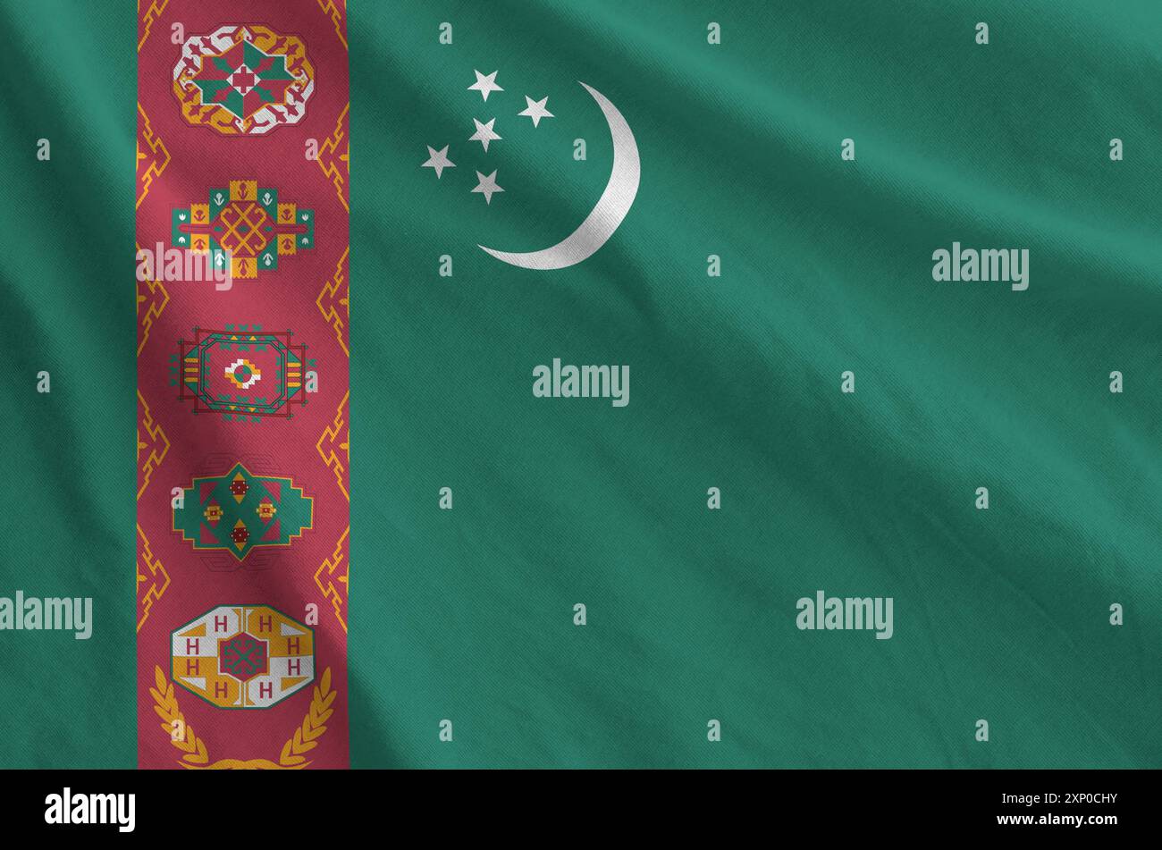 Turkmenistan flag depicted on folded wavy fabric of old cloth close up ...