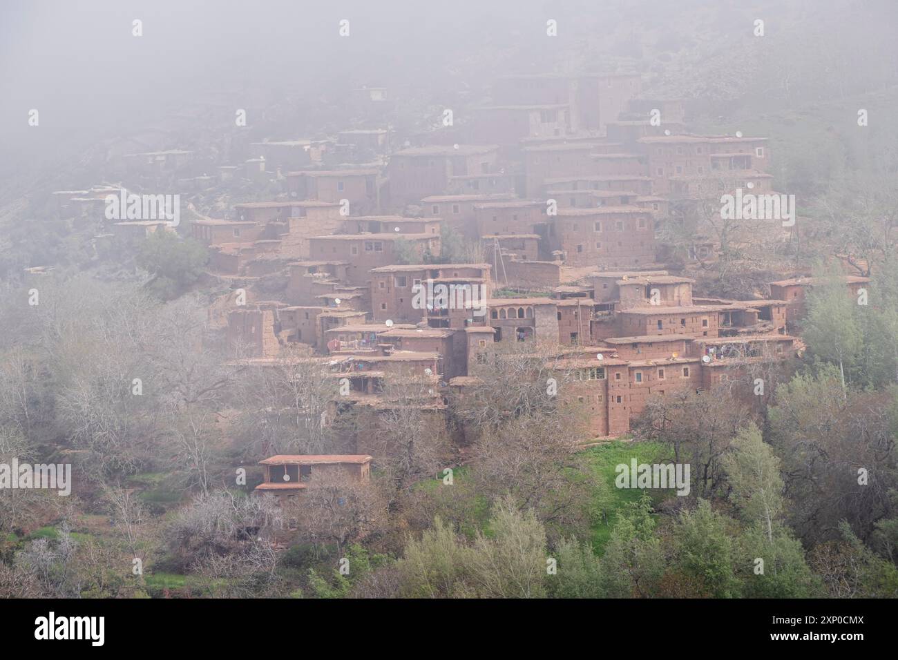 Typical adobe houses in the fog, Ait Blal, Atlas mountain range ...