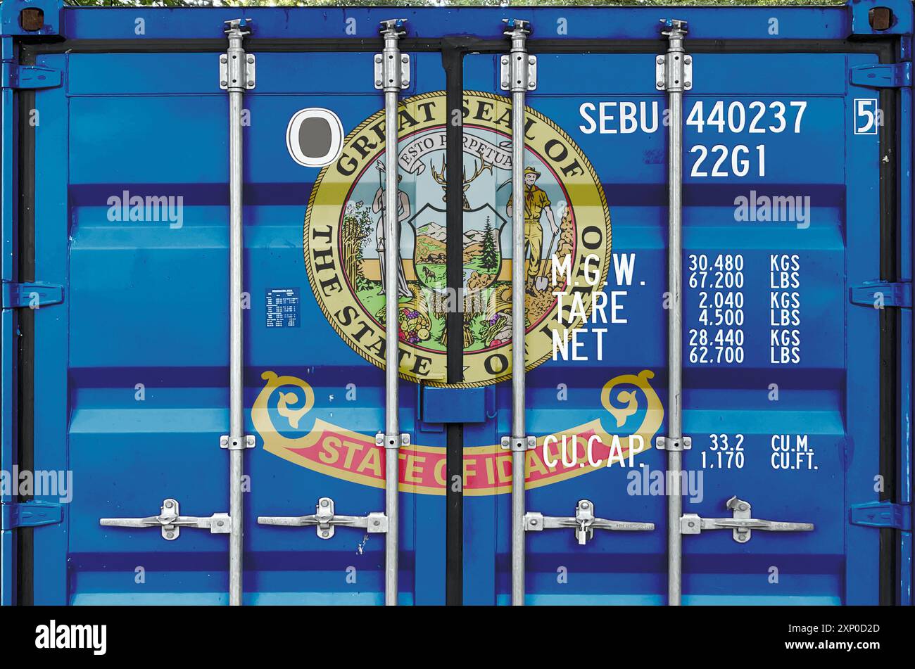 Idaho US state flag depicted on metal doors of shipping cargo container ...