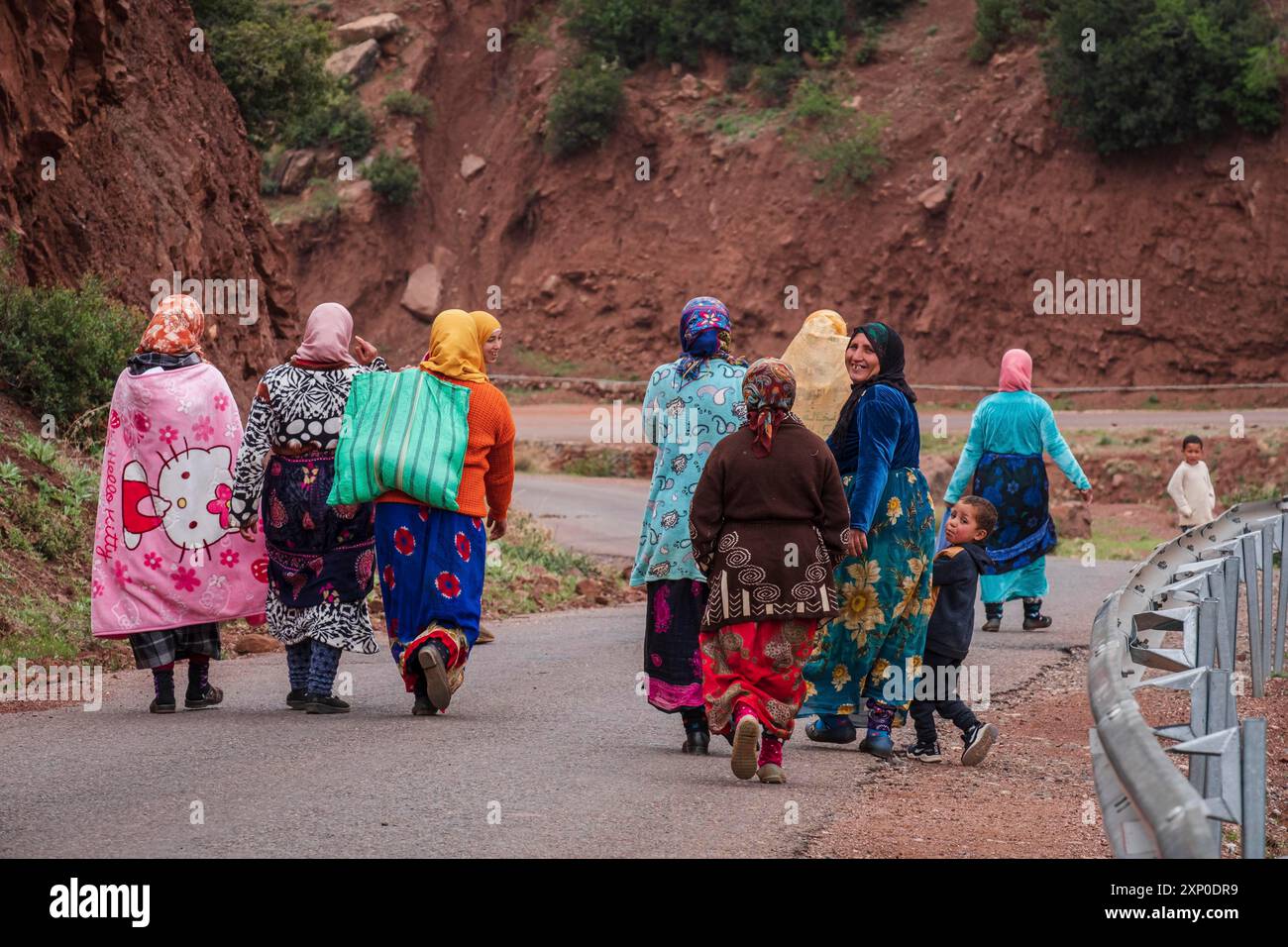 Group of berber women going to work on a paved road, Ait Blal, azilal ...