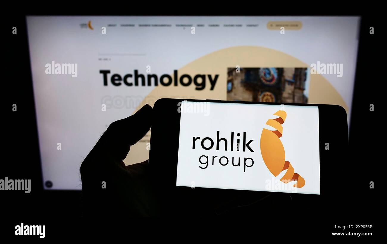 Stuttgart, Germany, 03-30-2022: Person holding cellphone with logo of Czech delivery company ...