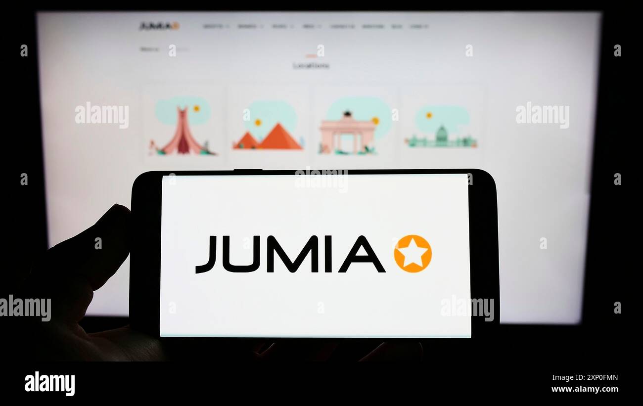 Stuttgart, Germany, 03-06-2022: Person holding cellphone with logo of Nigerian company Jumia ...