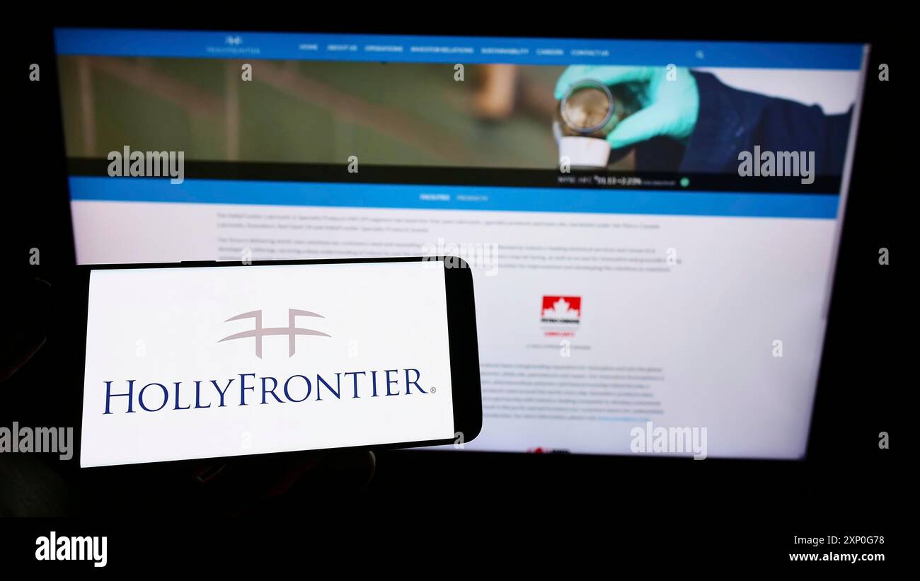 Stuttgart, Germany, 03-01-2022: Person holding mobile phone with logo ...