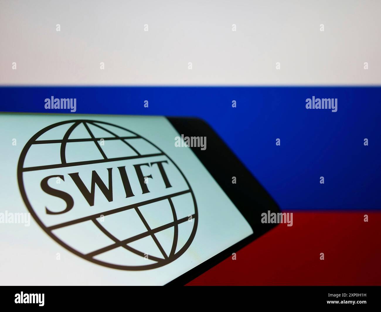 Stuttgart, Germany, 02-26-2022: Mobile phone with logo of banking transaction system SWIFT on ...