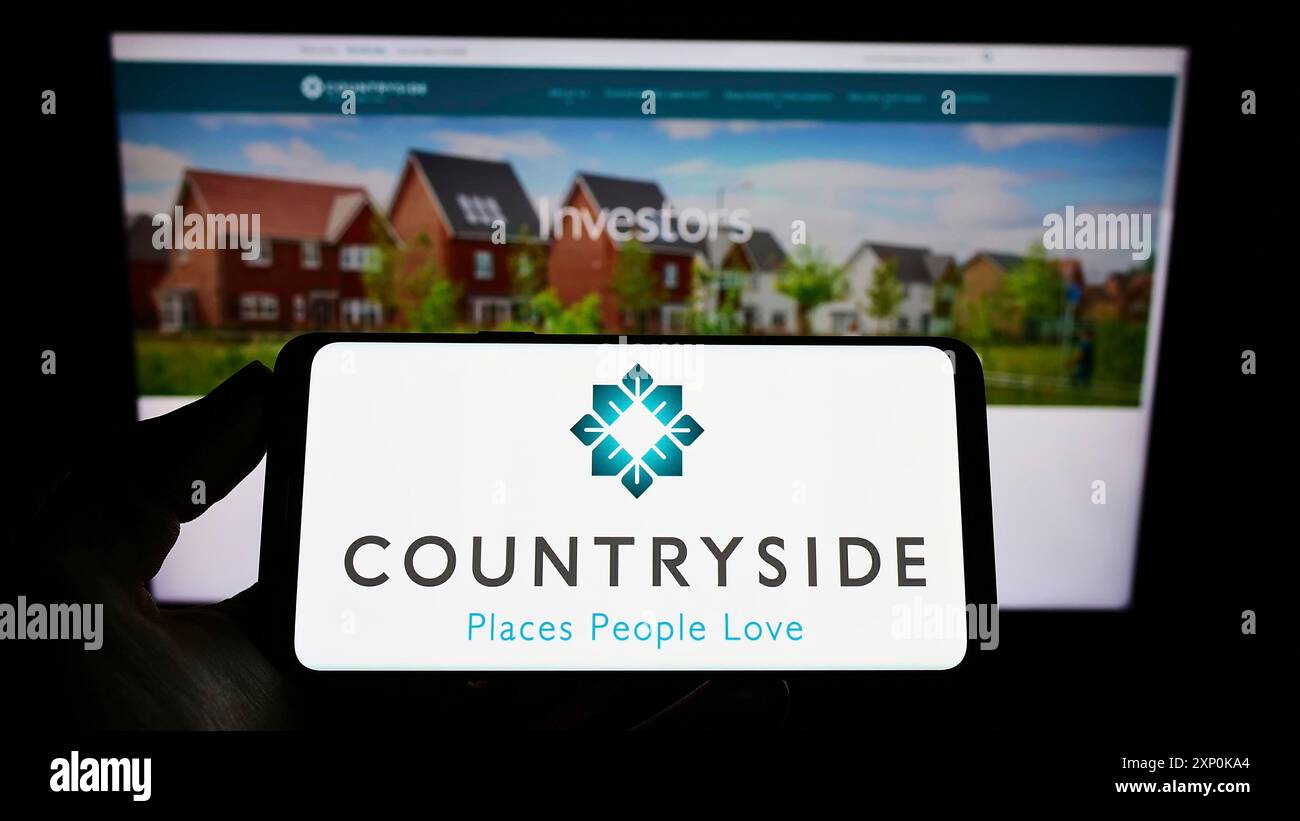 Stuttgart, Germany, 01-16-2022: Person holding smartphone with logo of ...