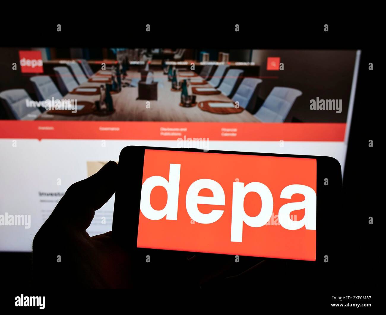 Stuttgart, Germany, 01-09-2022: Person holding mobile phone with logo ...