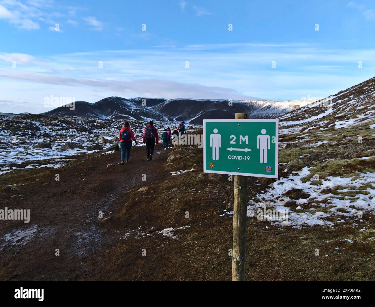 Grindavik, Iceland, 03-29-2021: People hiking on trail to recently ...