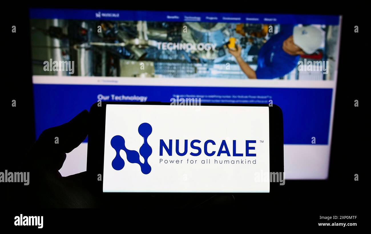 Stuttgart, Germany, 01-06-2022: Person holding mobile phone with logo ...