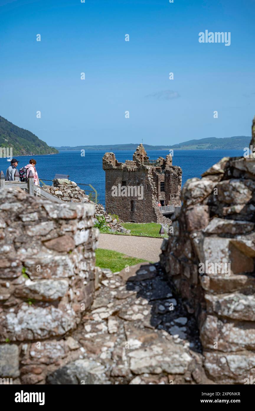 Urquhart Castle aerial view with tourist walking around, Loch ness ...