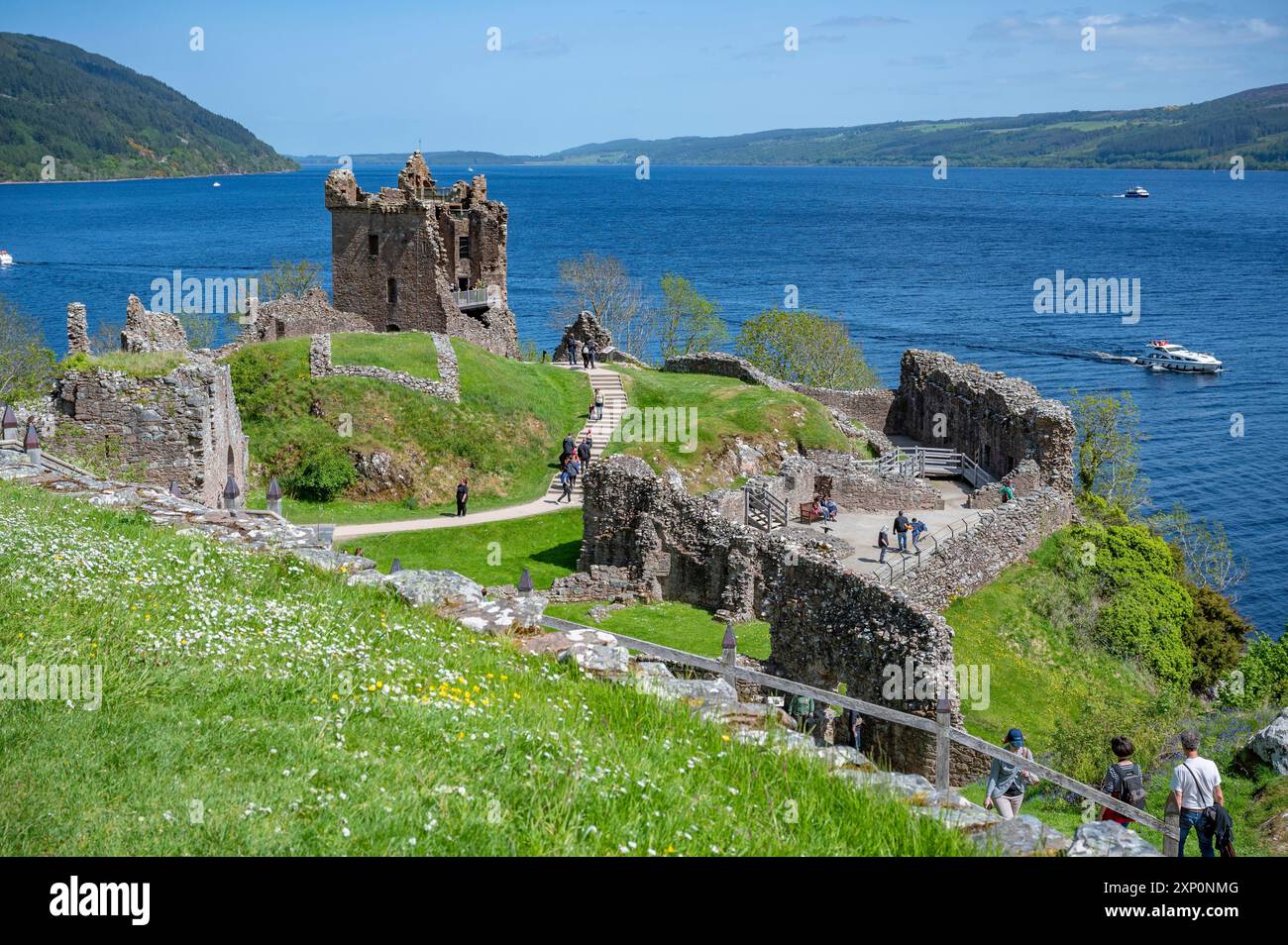 Urquhart Castle aerial view with lots of tourist walking around, Loch ...