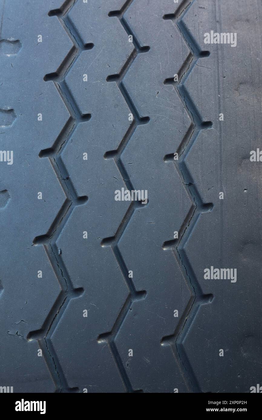 Close-up of worn threads on discarded black rubber truck tire, Quebec ...