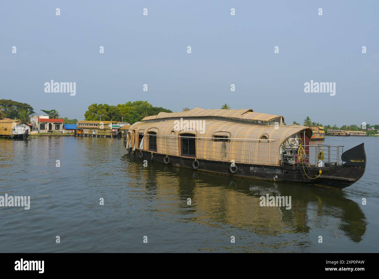 Houseboat in Kerala backwater sailing through the canals in Alappuzha ...