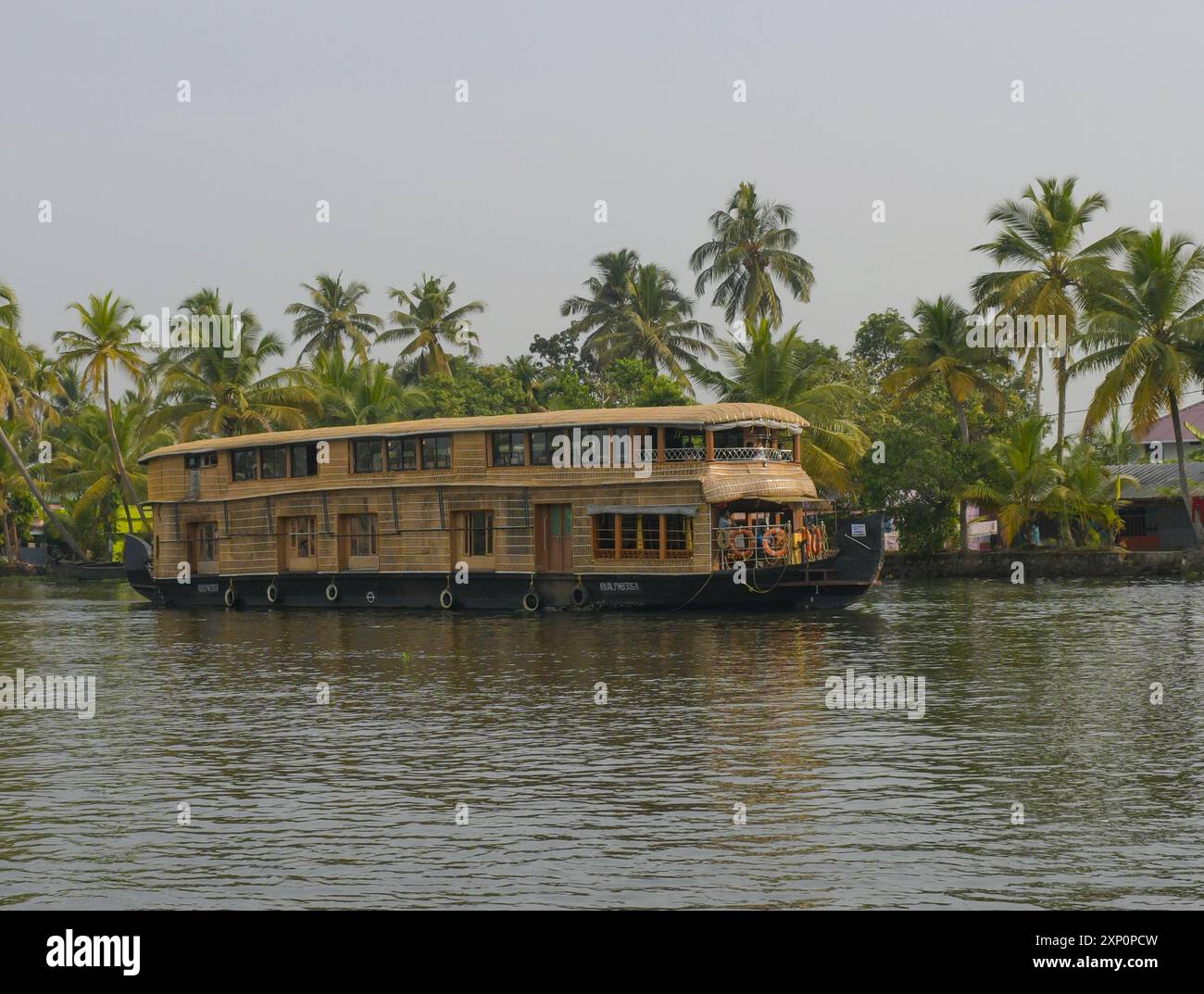 Houseboat in Kerala backwater sailing through the canals in Alappuzha ...