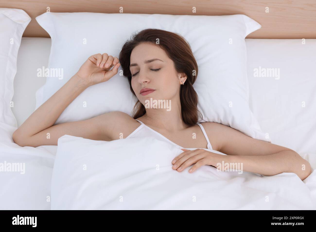 Bedtime. Woman sleeping in bed at home, top view Stock Photo - Alamy