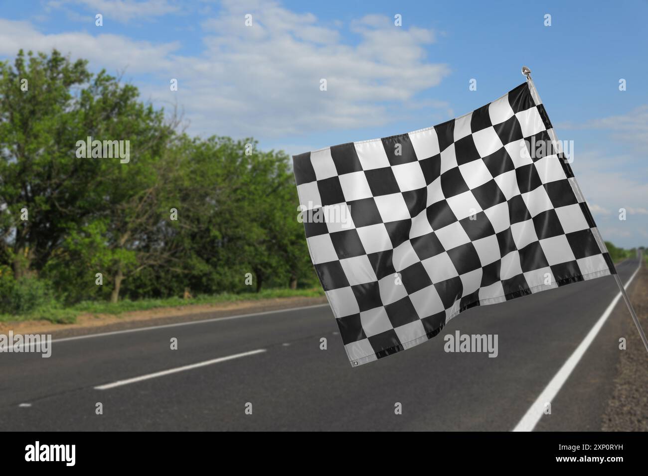 Checkered finish flag and asphalt racing track outdoors Stock Photo - Alamy