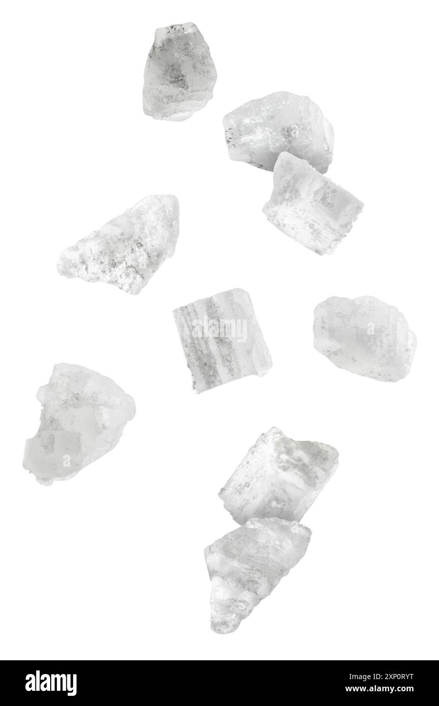 Sea salt crystals in air on white background Stock Photo - Alamy