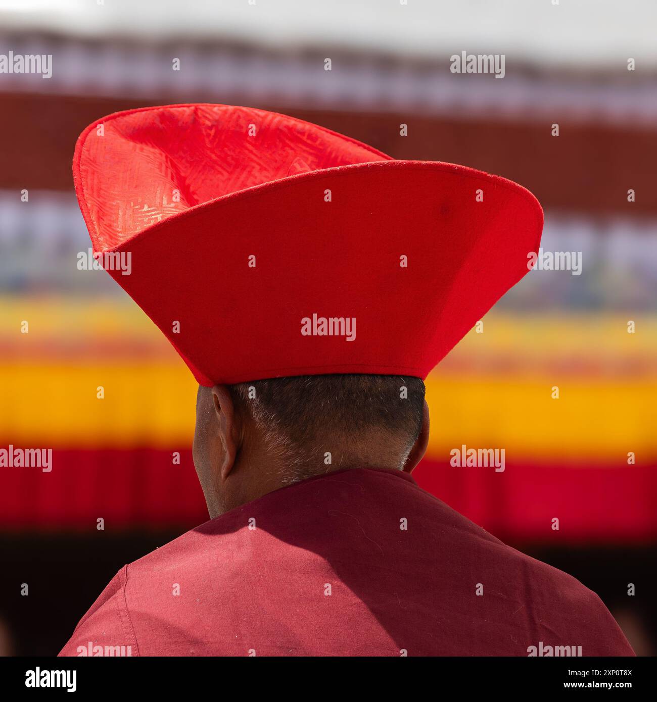 An abstract portrait of a Buddhist monk wearing a traditional hat and ...