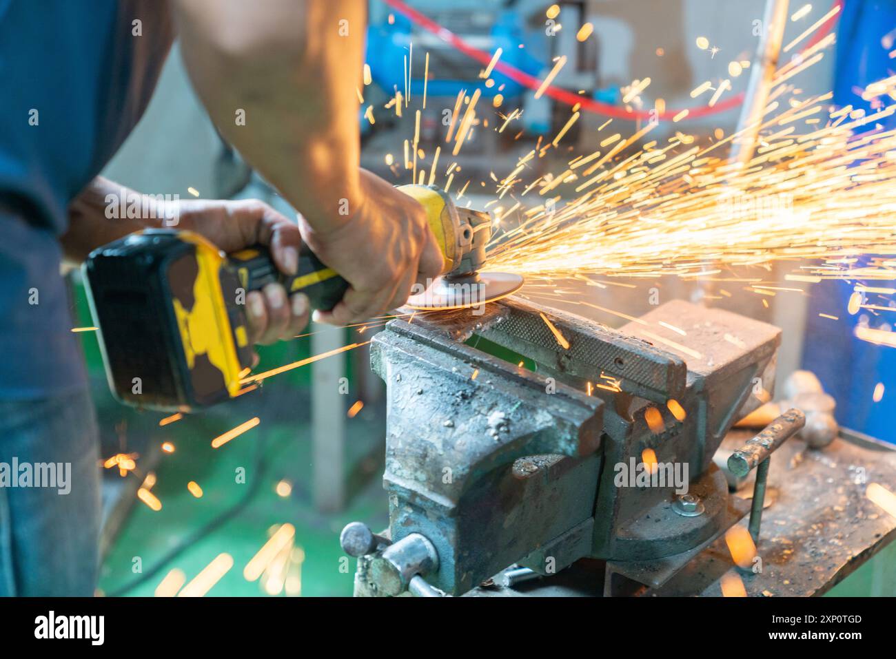 Technician is grinding iron with spark in an iron workshop Stock Photo ...