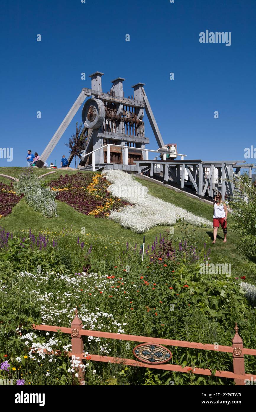 Landscaped flowers make butterfly image on the lawn in front of an old ...