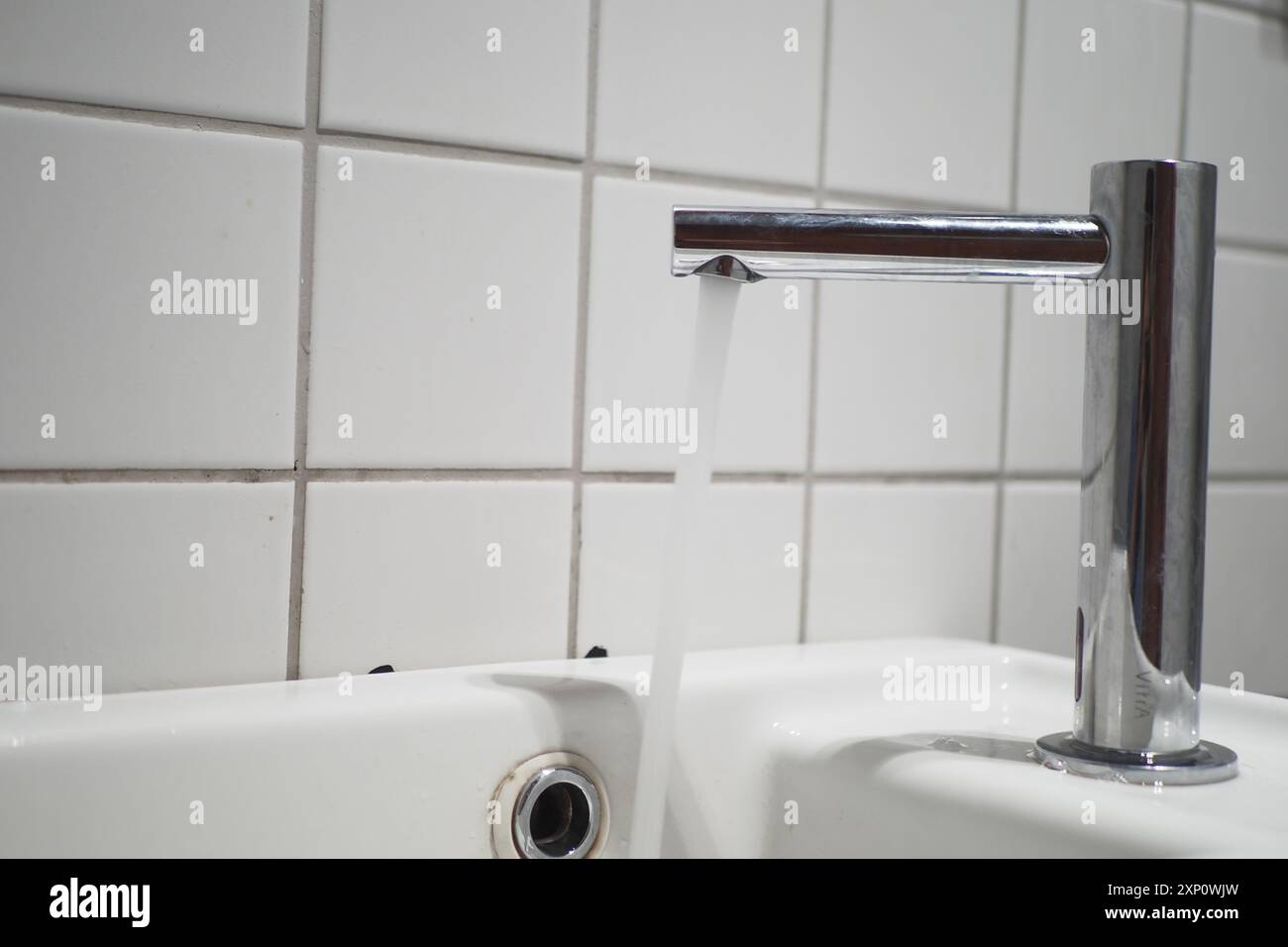 water pouring from a faucet tap slow motion Stock Photo - Alamy