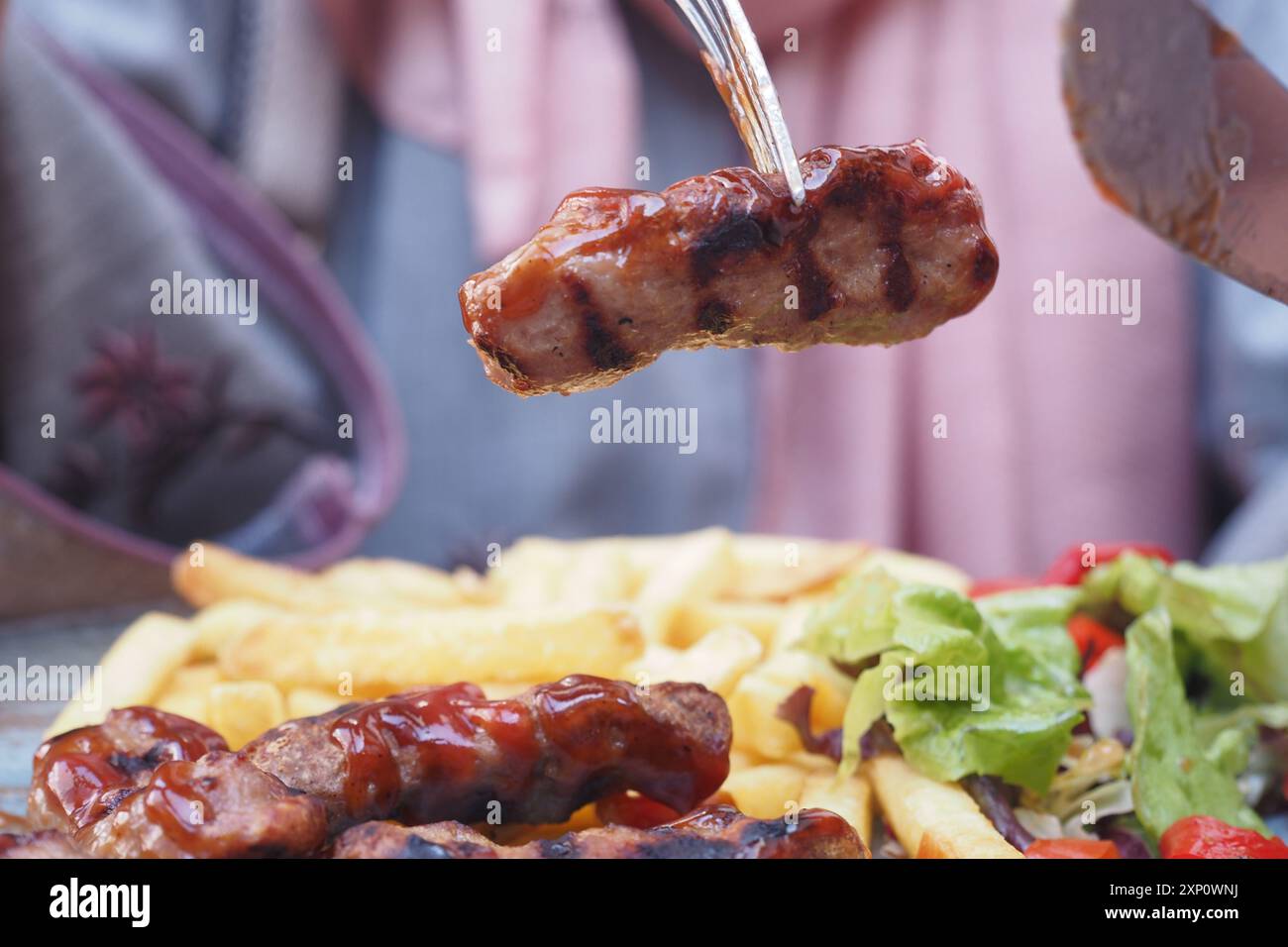 Traditional Turkish Kofte with french fries and salad on plate Stock ...