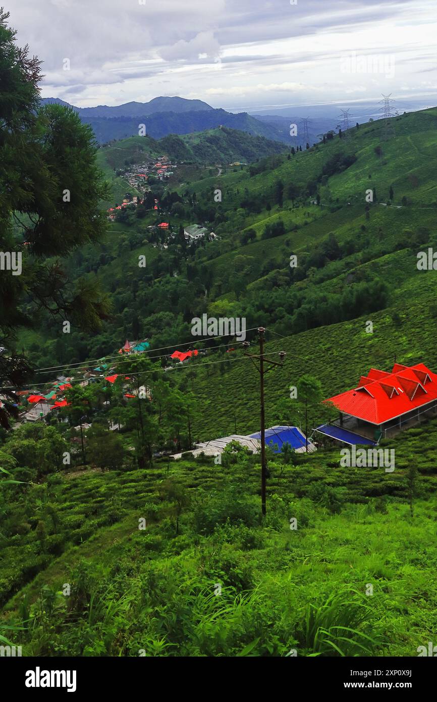 panoramic view of cloudy and foggy lush green himalayan mountain ...