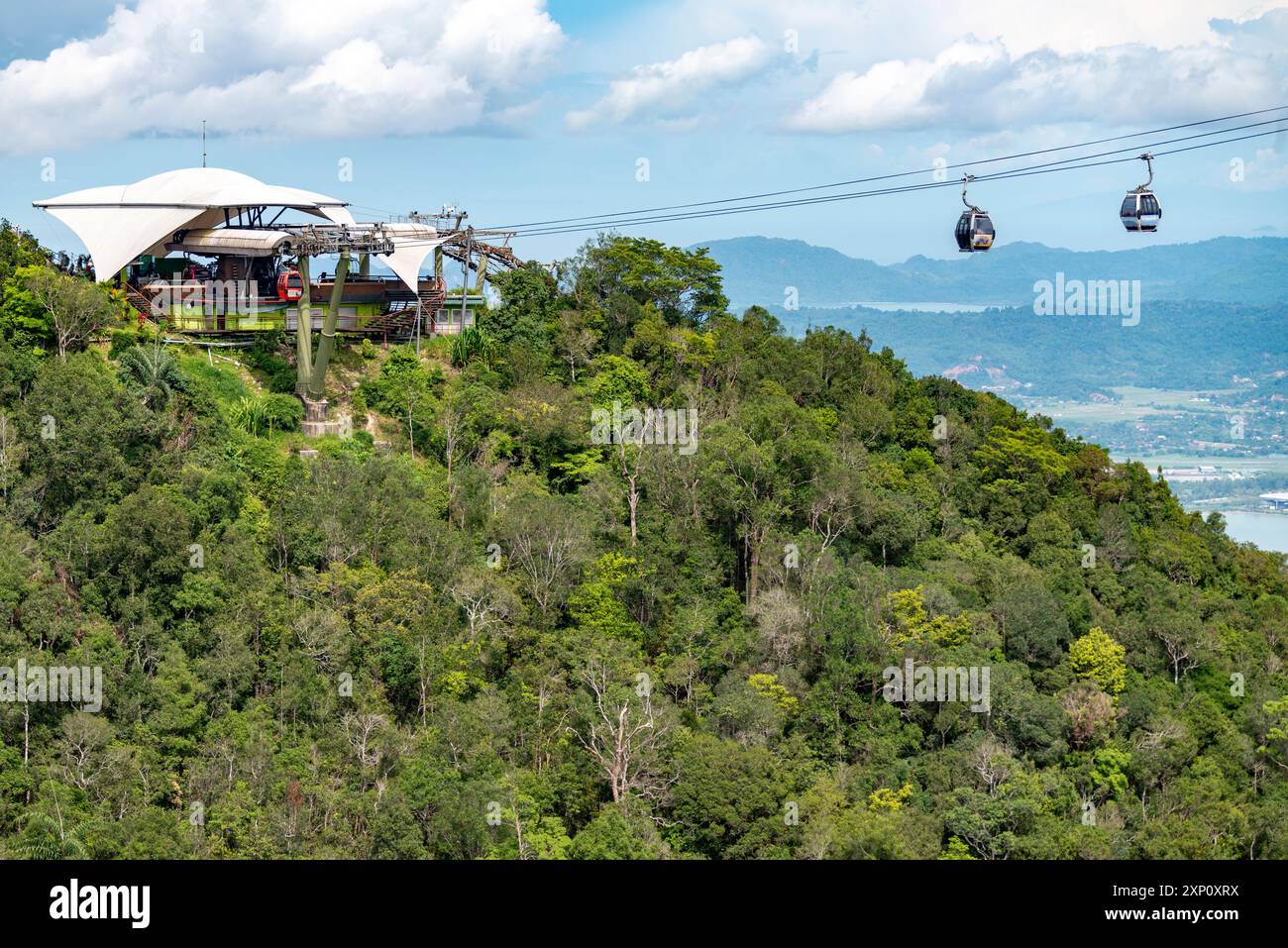 Running high over the forested peaks of Mat Cincang,the second highest ...