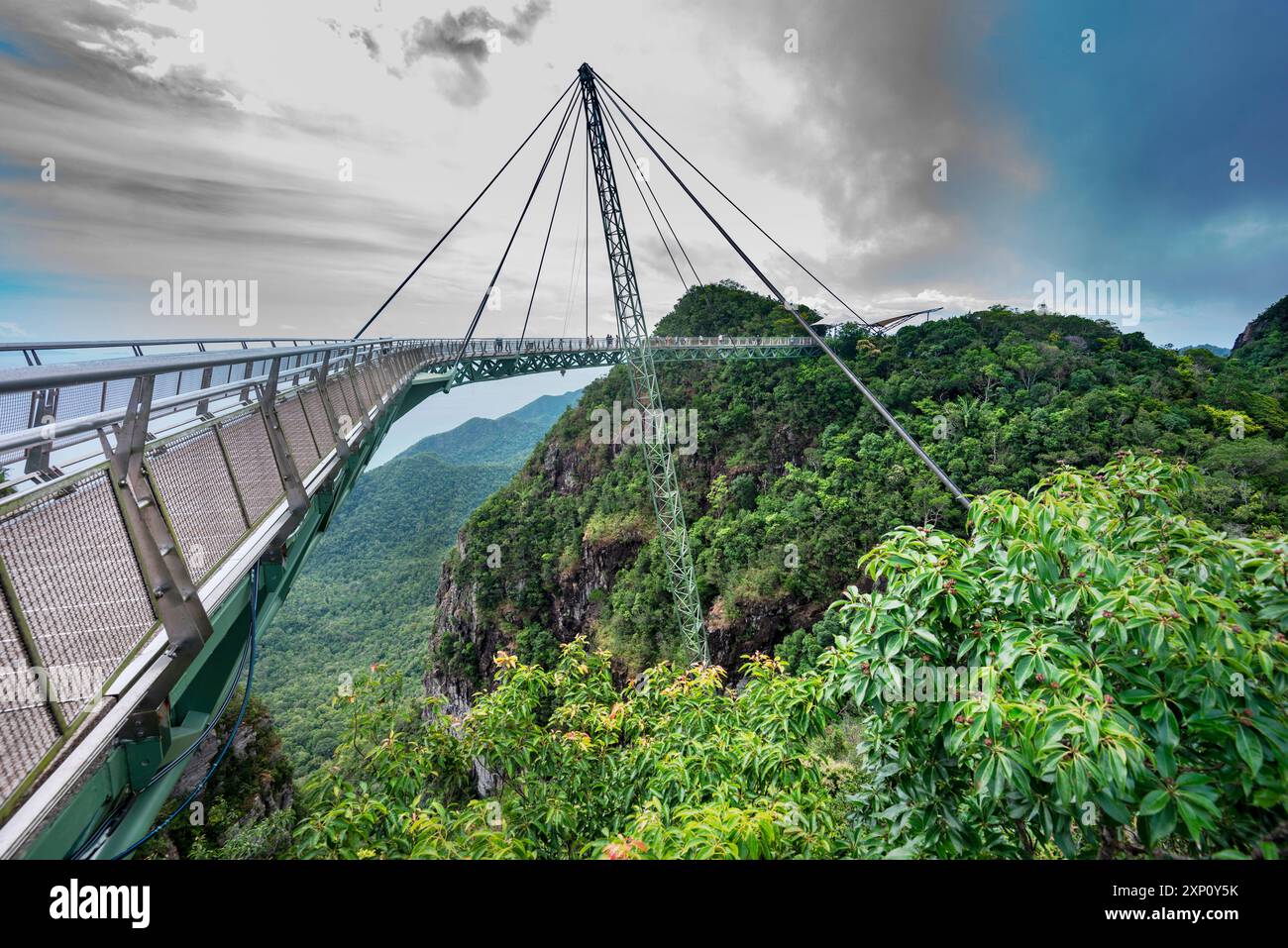 Winding over the forested peaks of Mat Cincang,second highest mountain ...
