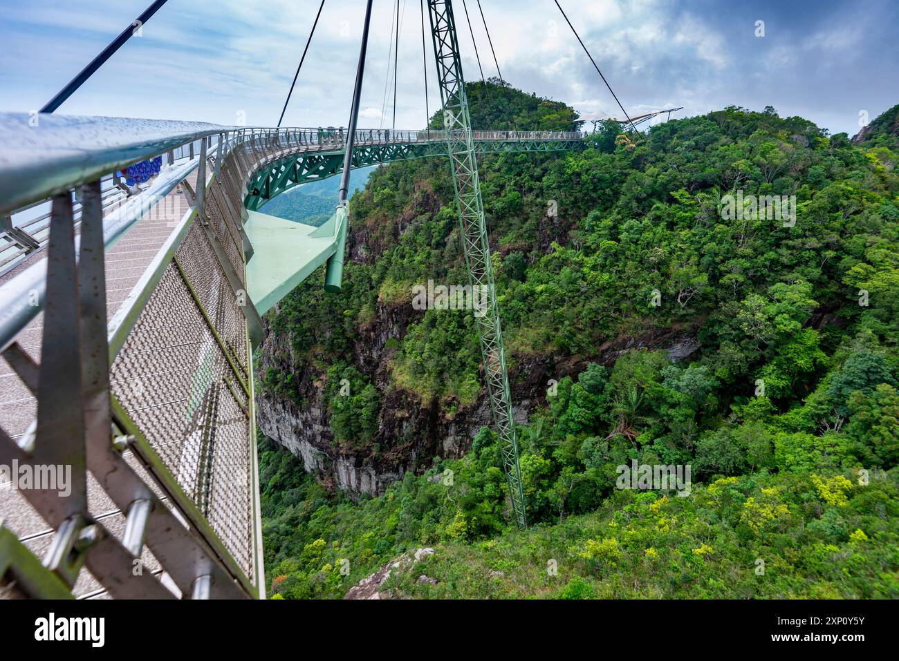 Winding over the forested peaks of Mat Cincang,second highest mountain ...