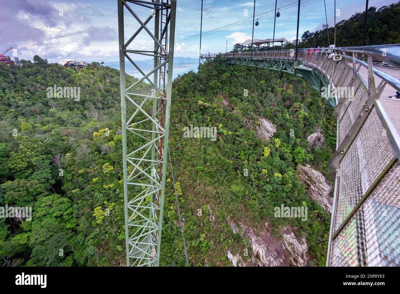 Winding over the forested peaks of Mat Cincang,second highest mountain ...