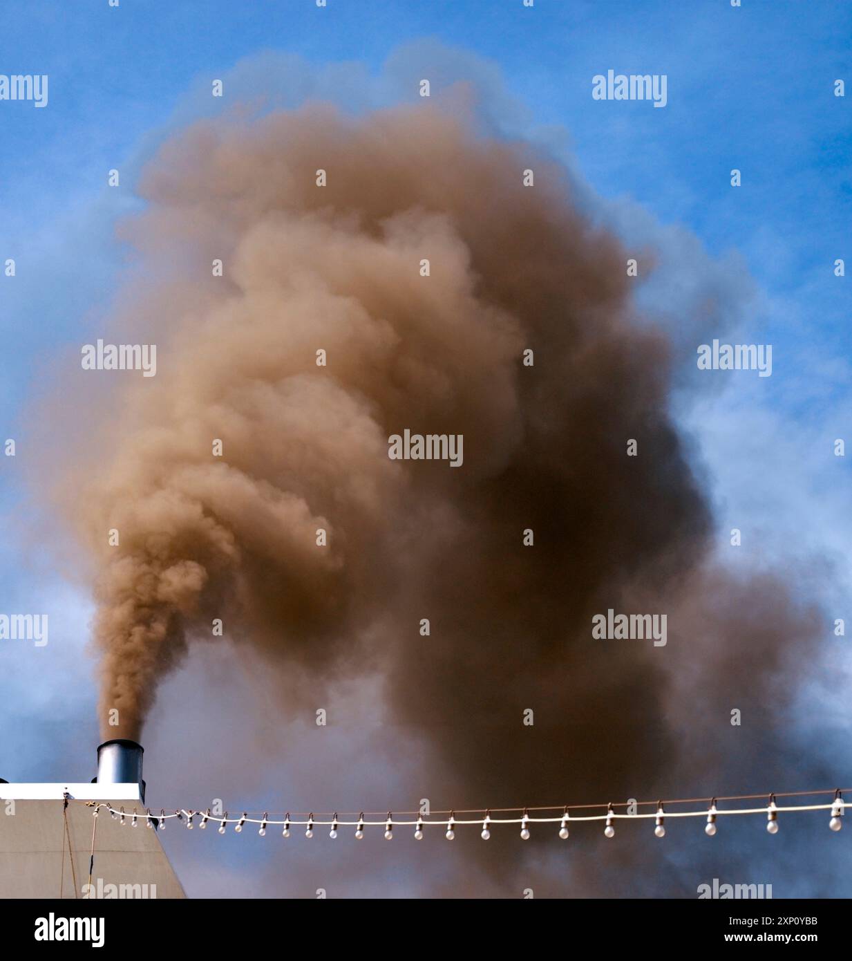 Smoke coming out of a chimney Stock Photo - Alamy