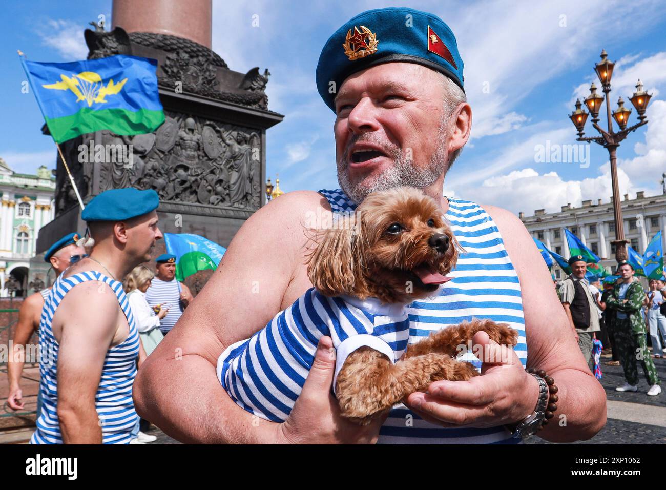 An Airborne Forces soldier holds a dog in his arms during the ...