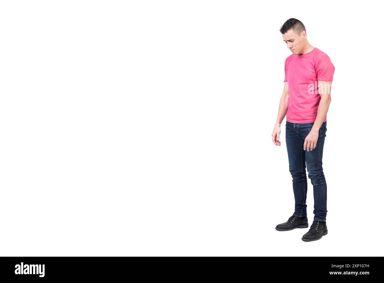 Discontent man standing in studio. White background Stock Photo - Alamy