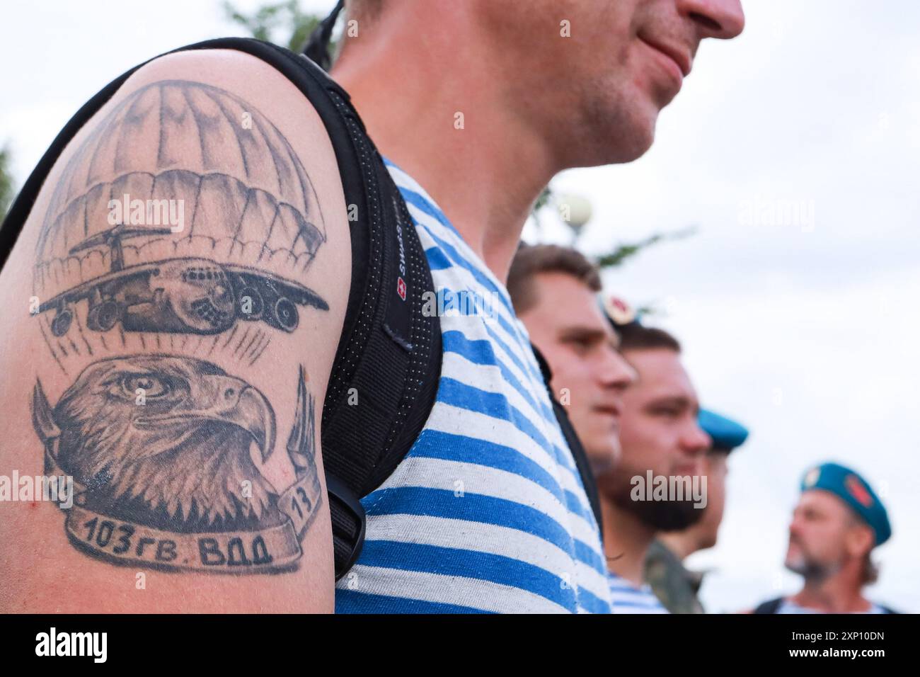 An airborne serviceman with a commemorative tattoo made during his ...