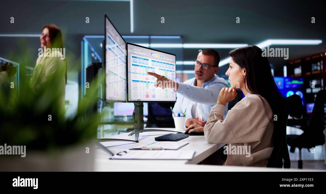 People Working With Spreadsheet Data On Computer Monitor Stock Photo ...