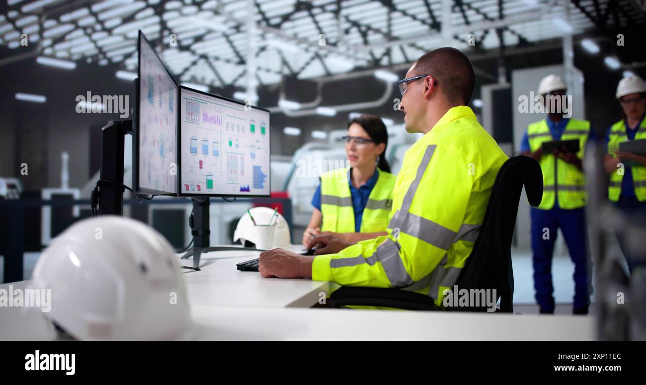 Engineer Operators Using Scada System At Industrial Plant Stock Photo - Alamy